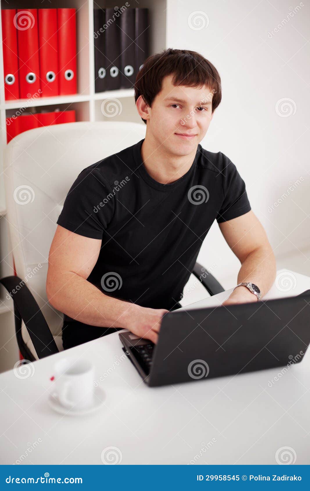 Young guy using laptop stock image. Image of employee - 29958545