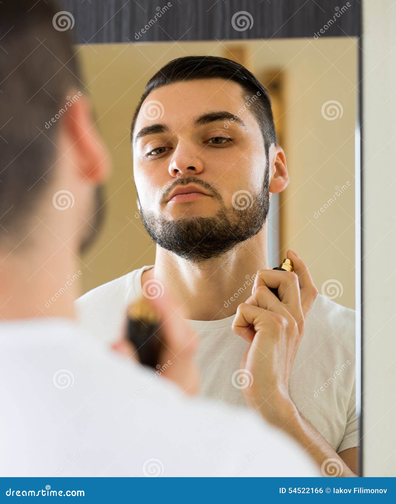 Young Guy Using Perfume at Home Stock Photo - Image of fragrances ...
