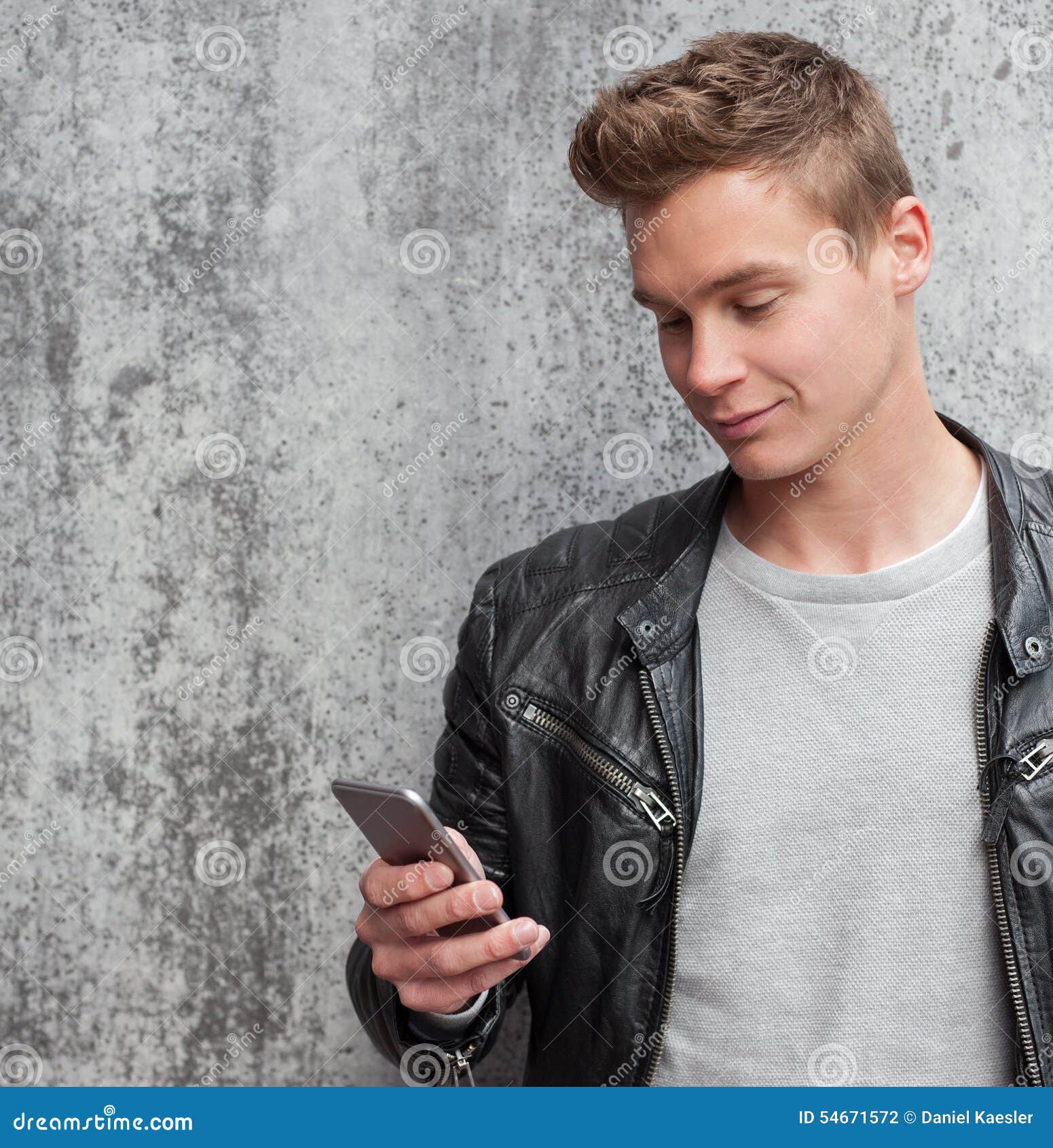 Young Guy Using Smart Phone Stock Photo - Image of concrete, teenager ...