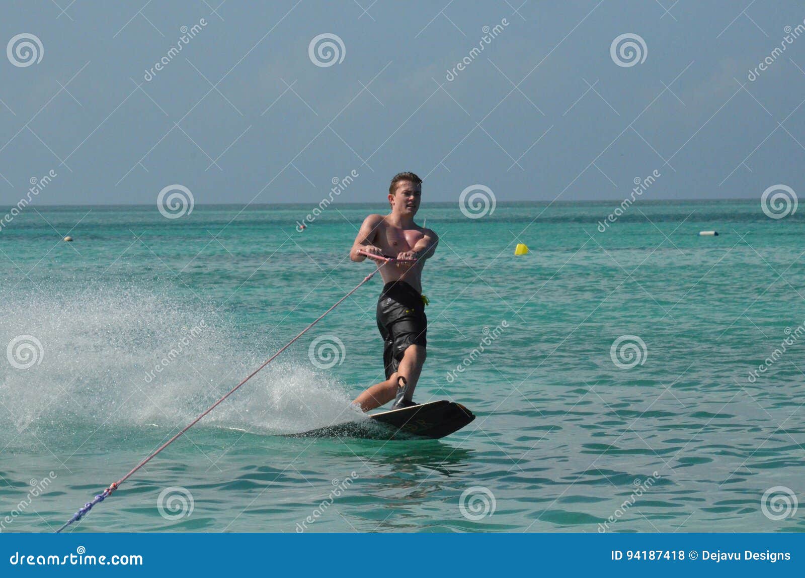 Young Guy Wakeboarding in the Tropical Blue Waters of Aruba Stock Photo ...