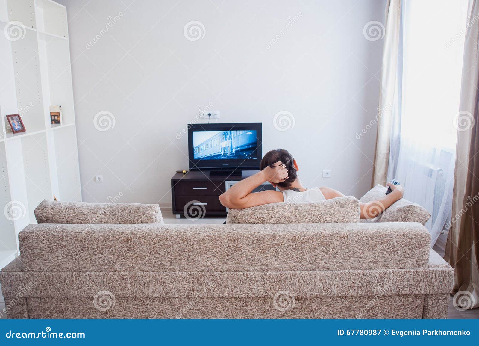 Young Guy is Watching TV the View from Back Stock Image - Image of ...
