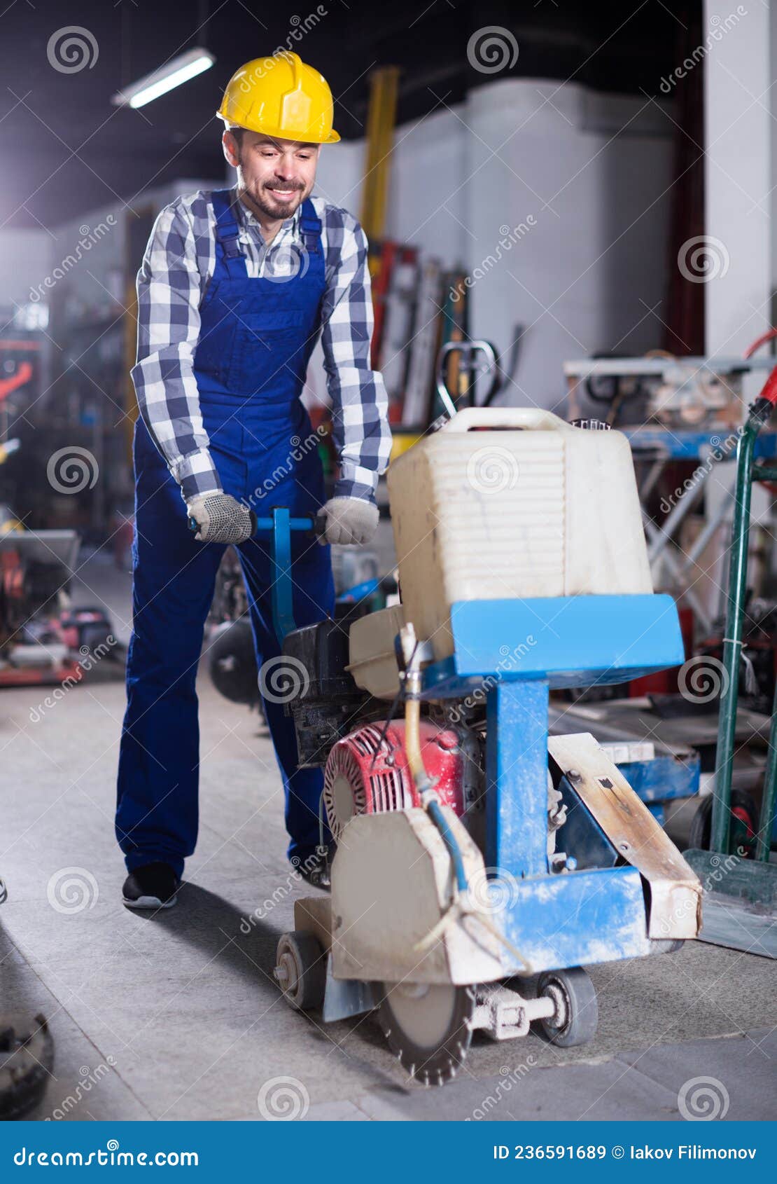 Young Guy Worker is Using Gas Saw for Construction Work Stock Image ...