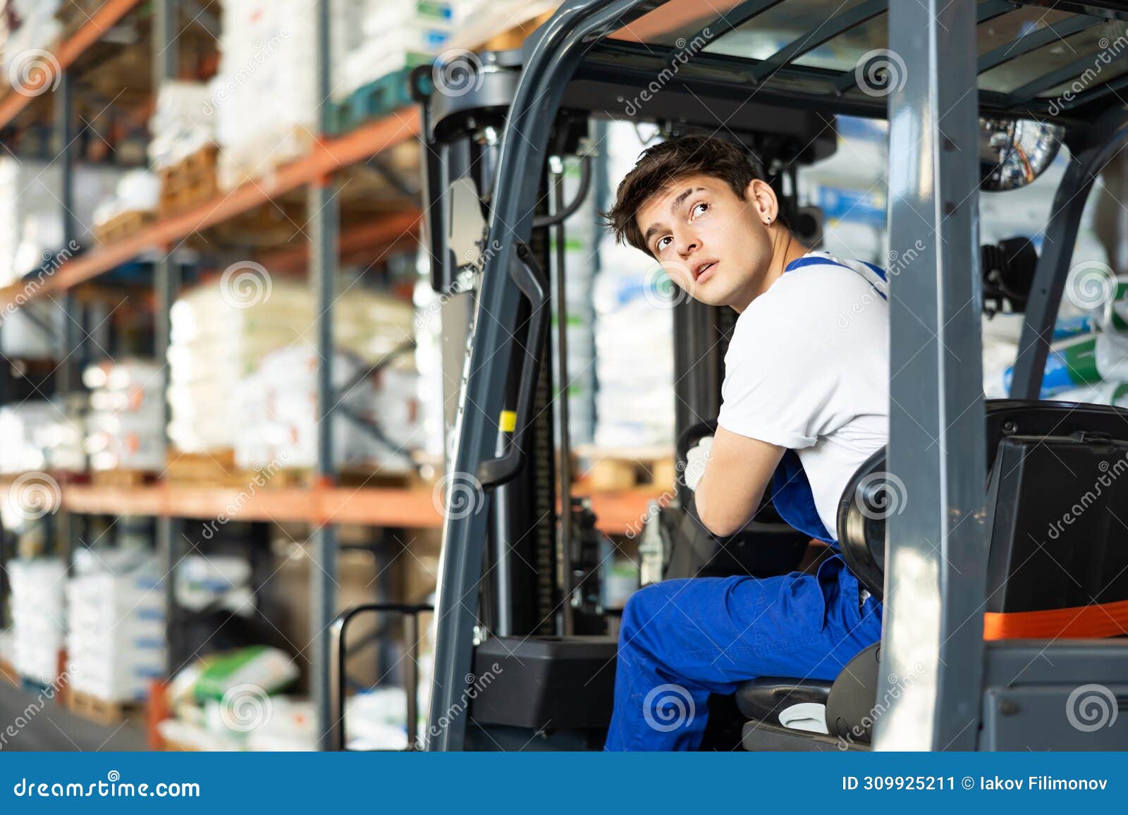 Young Guy Worker Works on Loader in Warehouse Stock Image - Image of ...