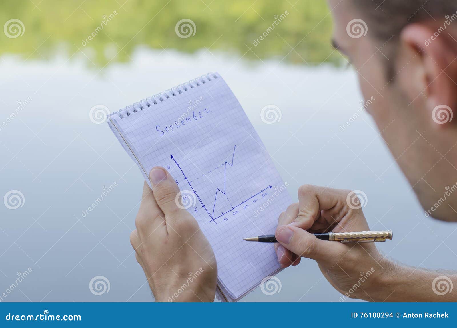 The Young Guy Writes in a Notebook Stock Photo - Image of give, holds ...