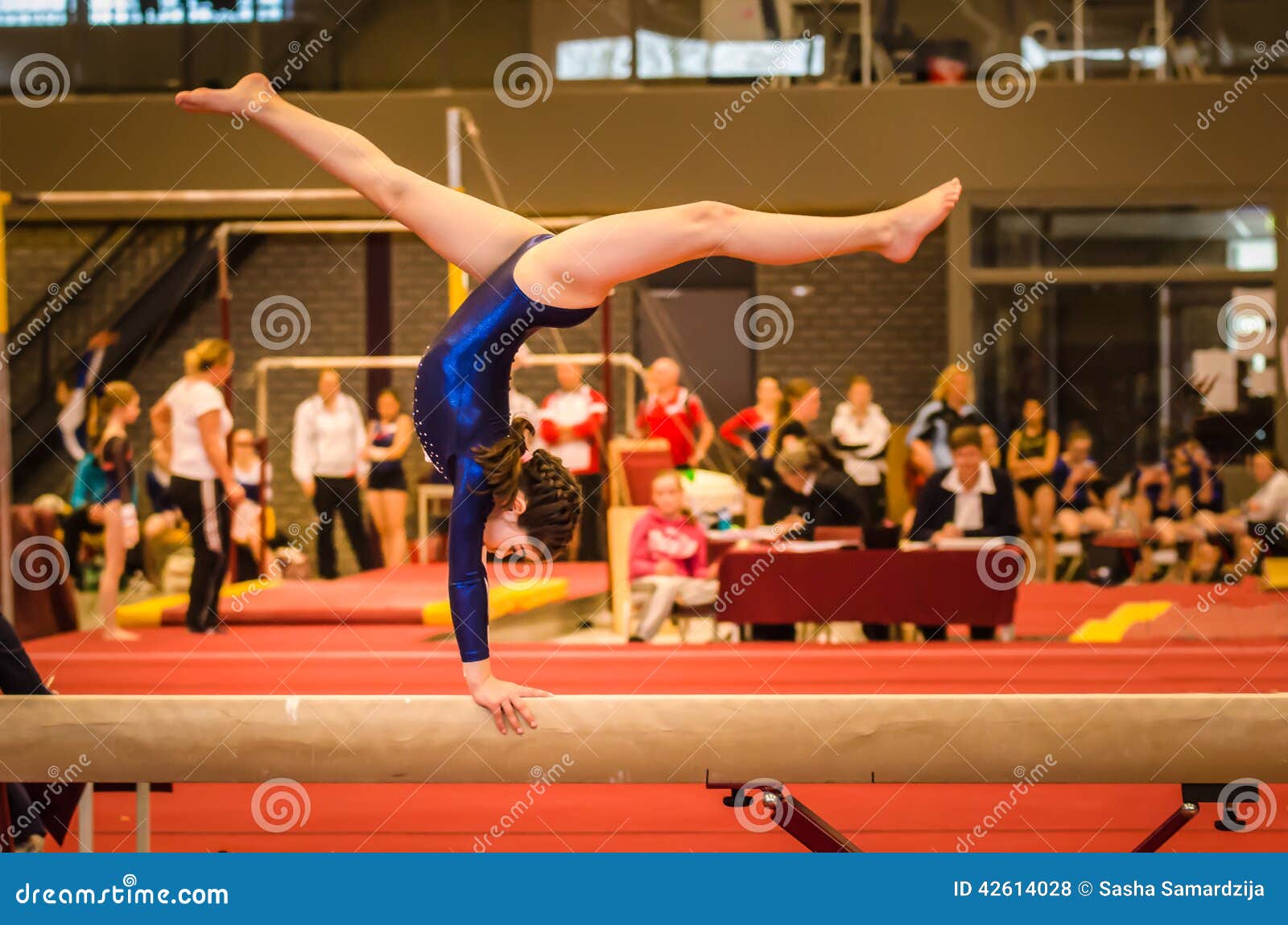 Young Gymnast Girl Performing Routine on Balance B Stock Photo - Image ...