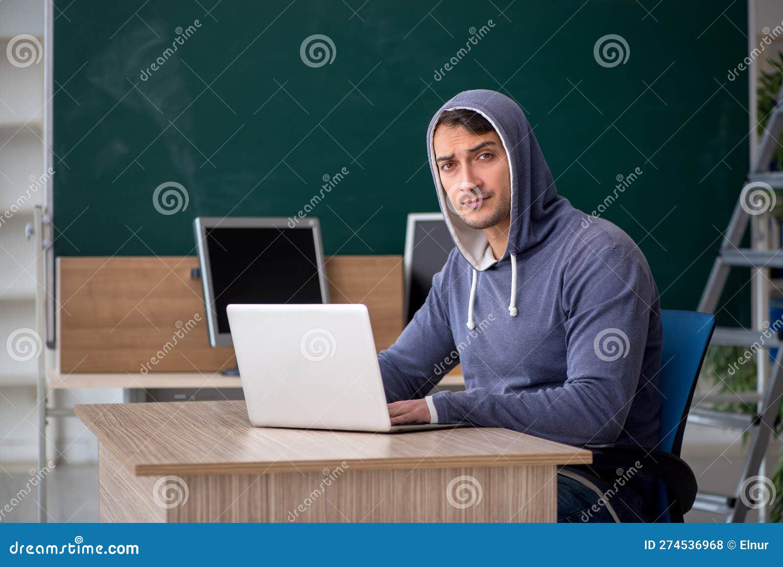 Young Male Hacker Sitting in the Classroom Stock Photo - Image of ...
