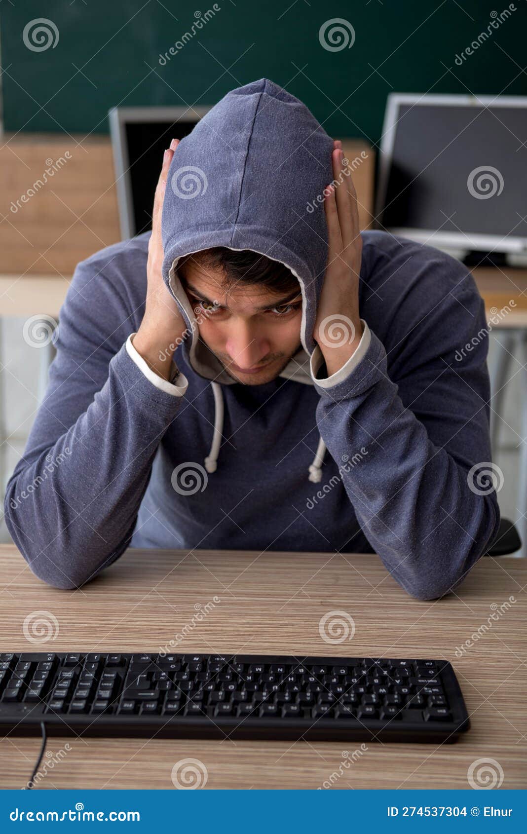 Young Male Hacker Sitting in the Classroom Stock Photo - Image of ...