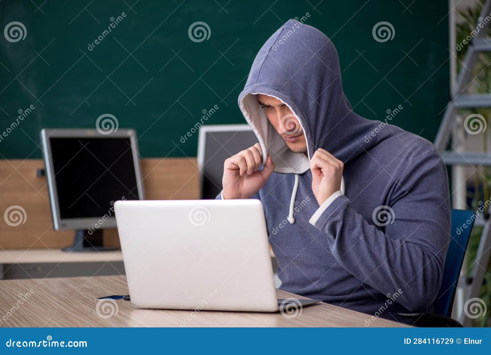 Young Male Hacker Sitting in the Classroom Stock Image - Image of ...