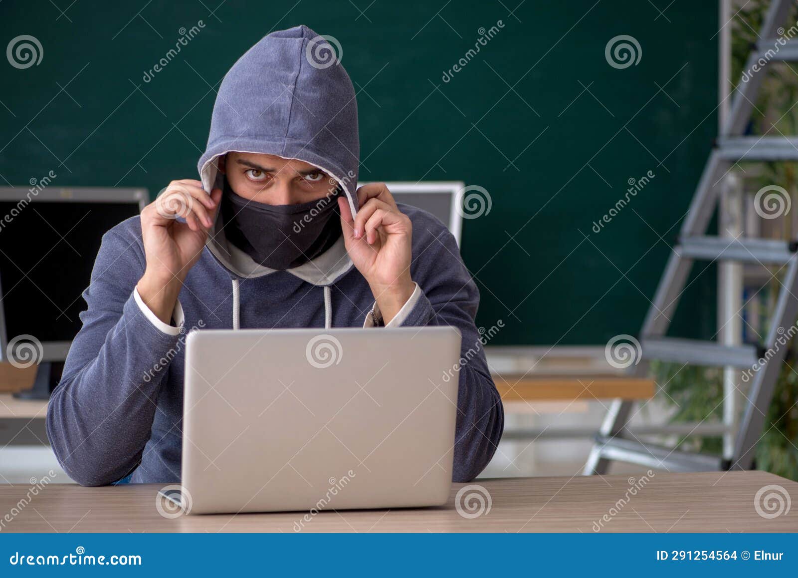 Young Male Hacker Sitting in the Classroom Stock Photo - Image of ...