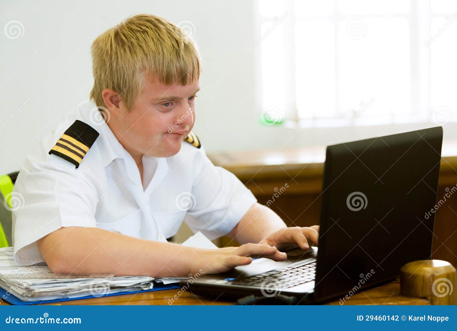 Young Handicapped Pilot Working with Laptop. Stock Photo - Image of ...
