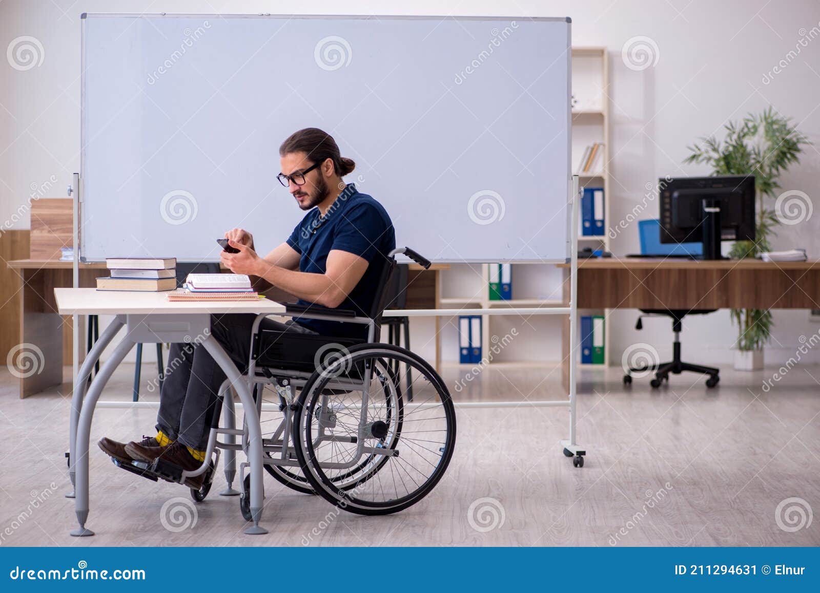 Young Male Handicapped Student in the Classroom Stock Image - Image of ...