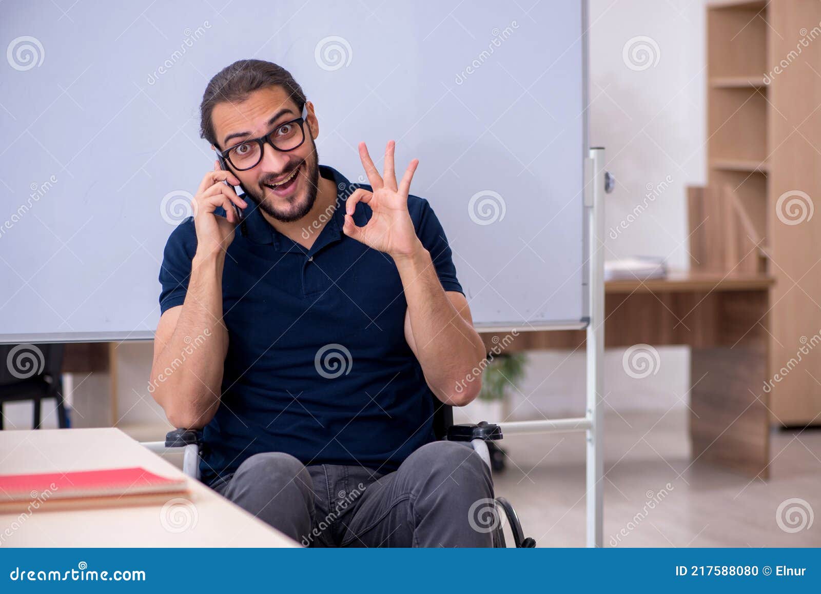 Young Male Handicapped Student in the Classroom Stock Photo - Image of ...