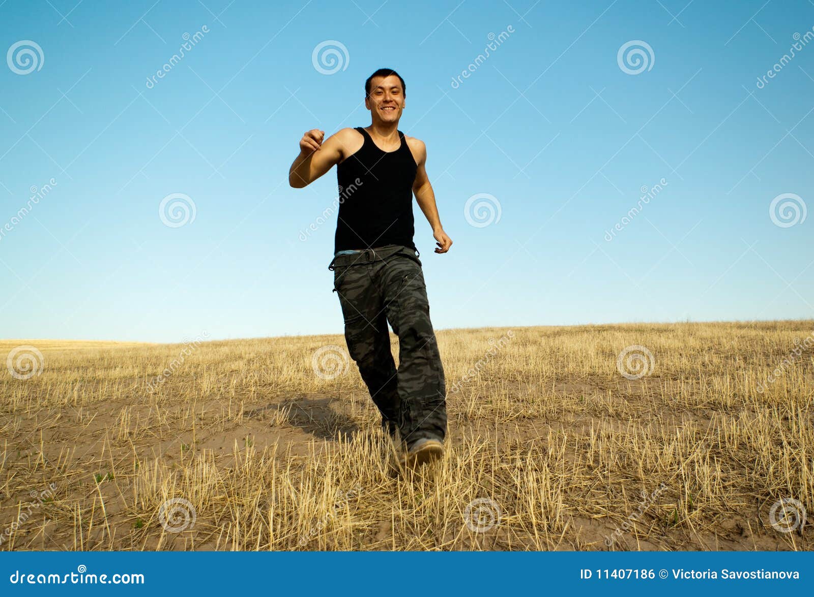Young Handsome Asian Man Running Stock Photo - Image of running, yellow ...