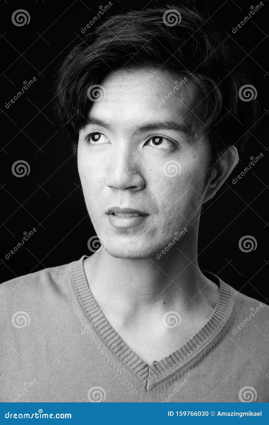Young Handsome Asian Man Thinking Against Black Background Stock Photo ...