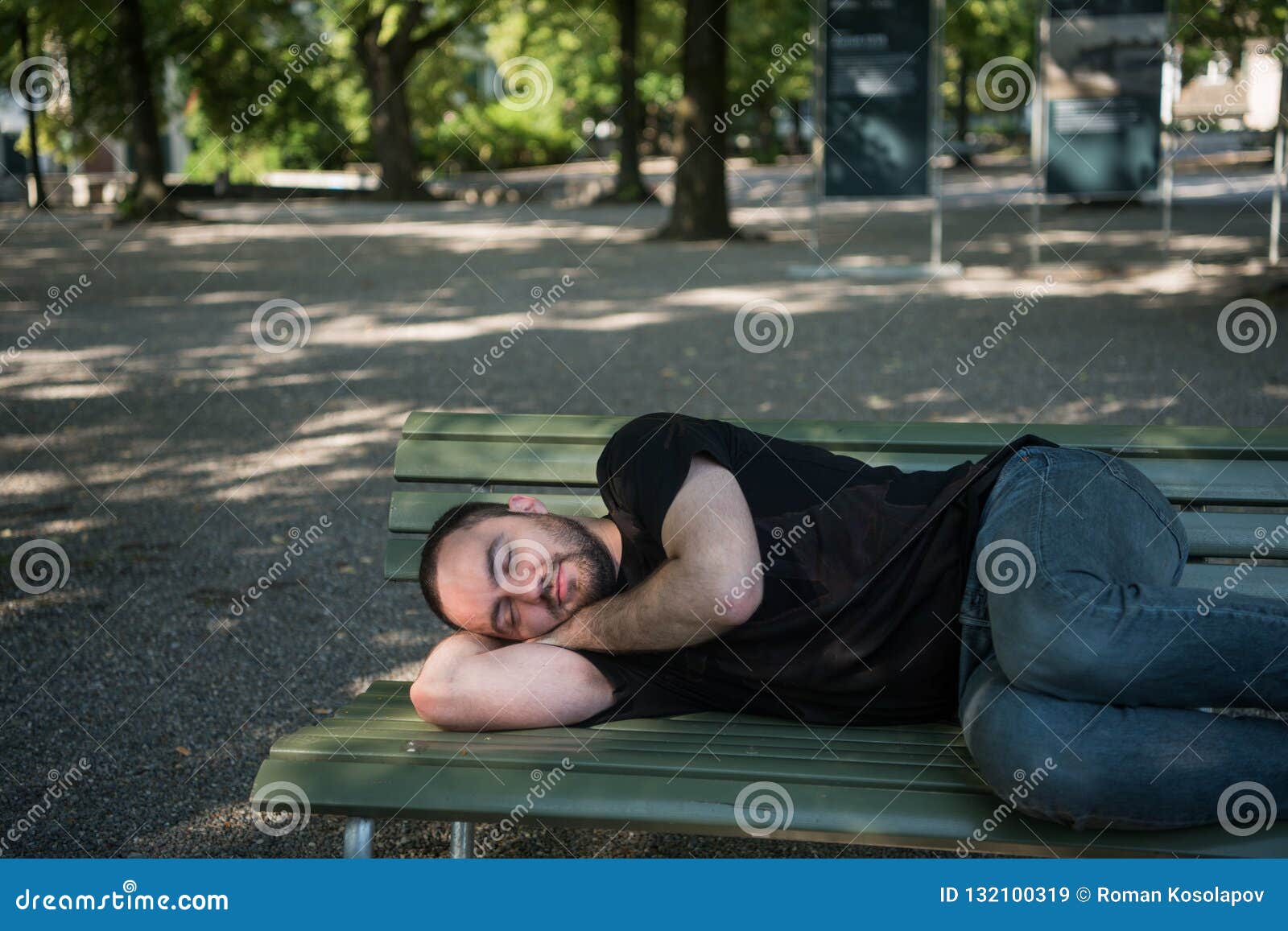 Young Handsome Bearded Man is Sleeping on a Park Bench Stock Image ...