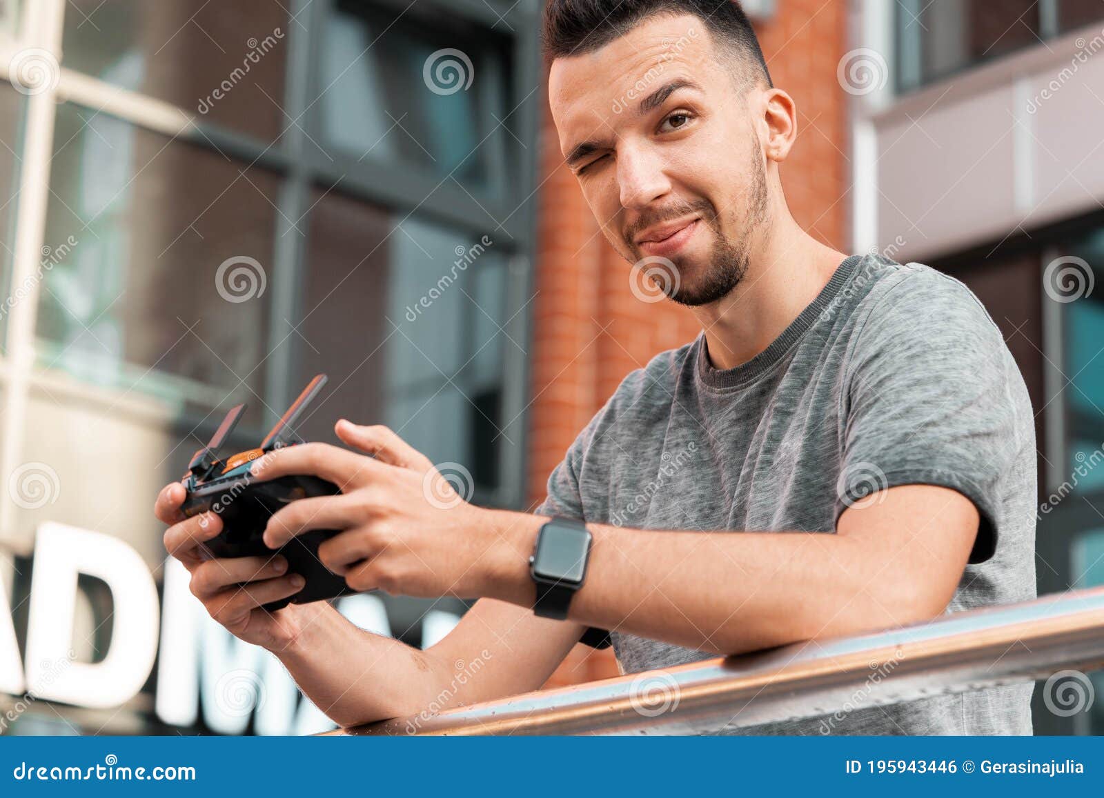 Young Handsome Brunette Man Launching Drone Quadcopter and Holding ...