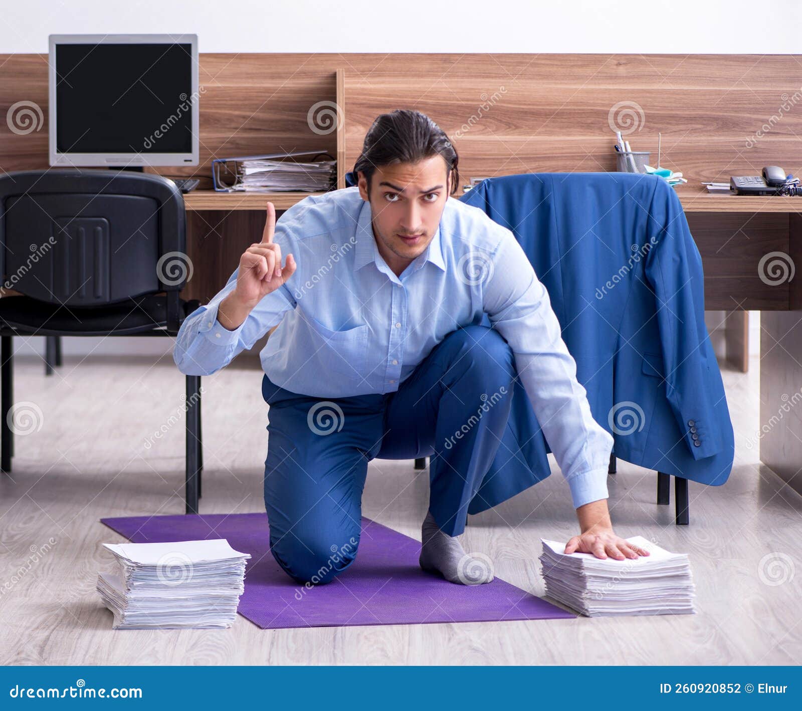 Young Handsome Businessman Doing Exercises at Workplace Stock Photo ...