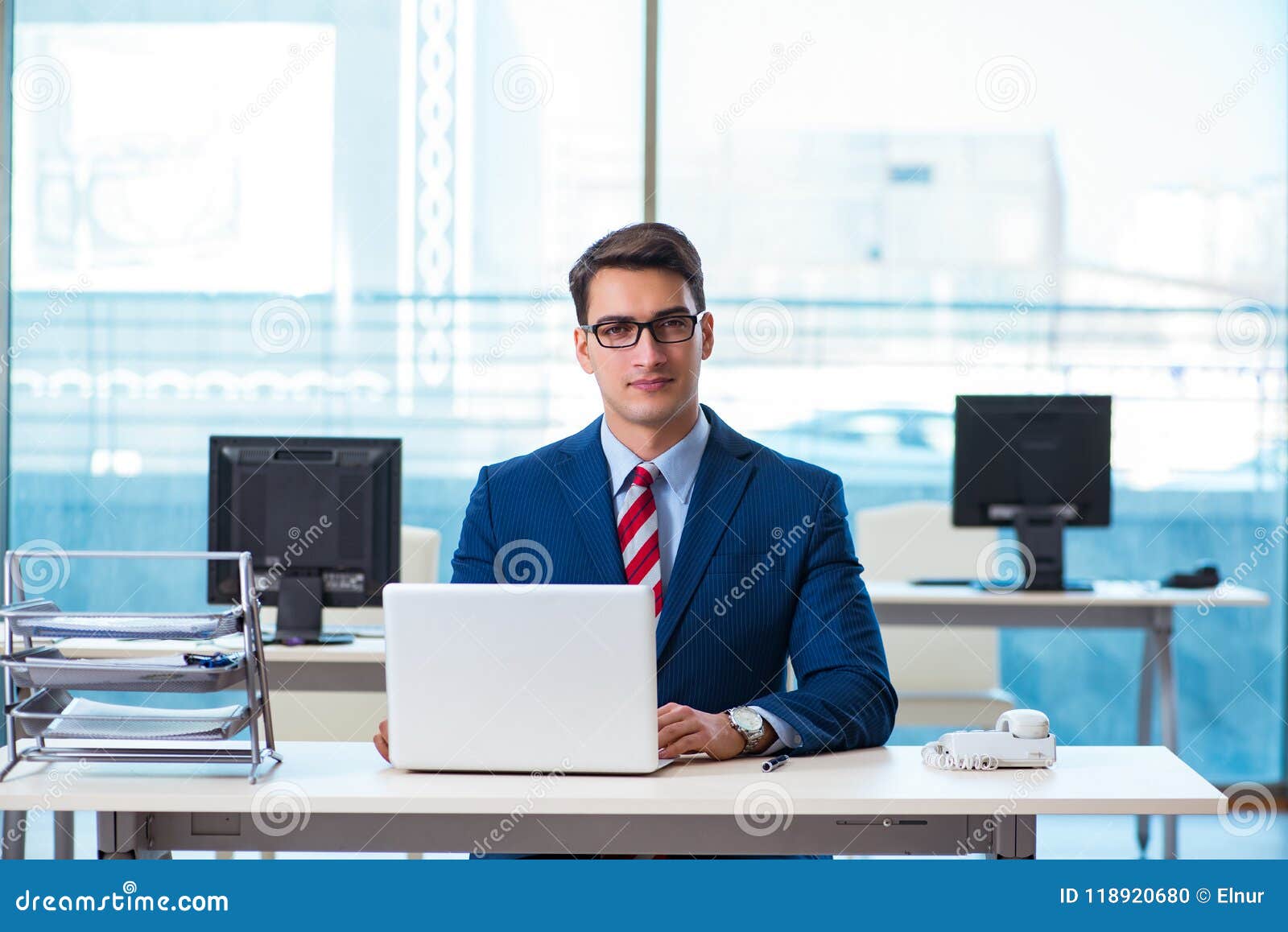 The Young Handsome Businessman Employee Working in Office at Desk Stock ...