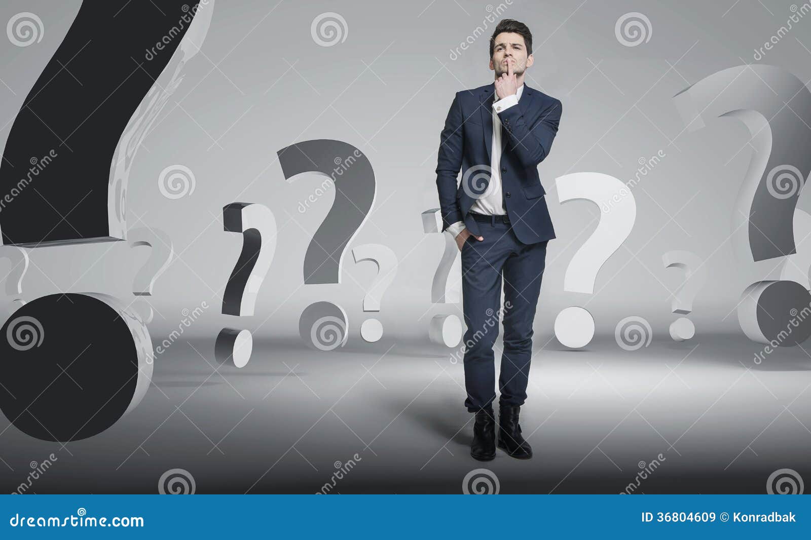 Young Handsome Businessman among Question Marks Stock Image - Image of ...