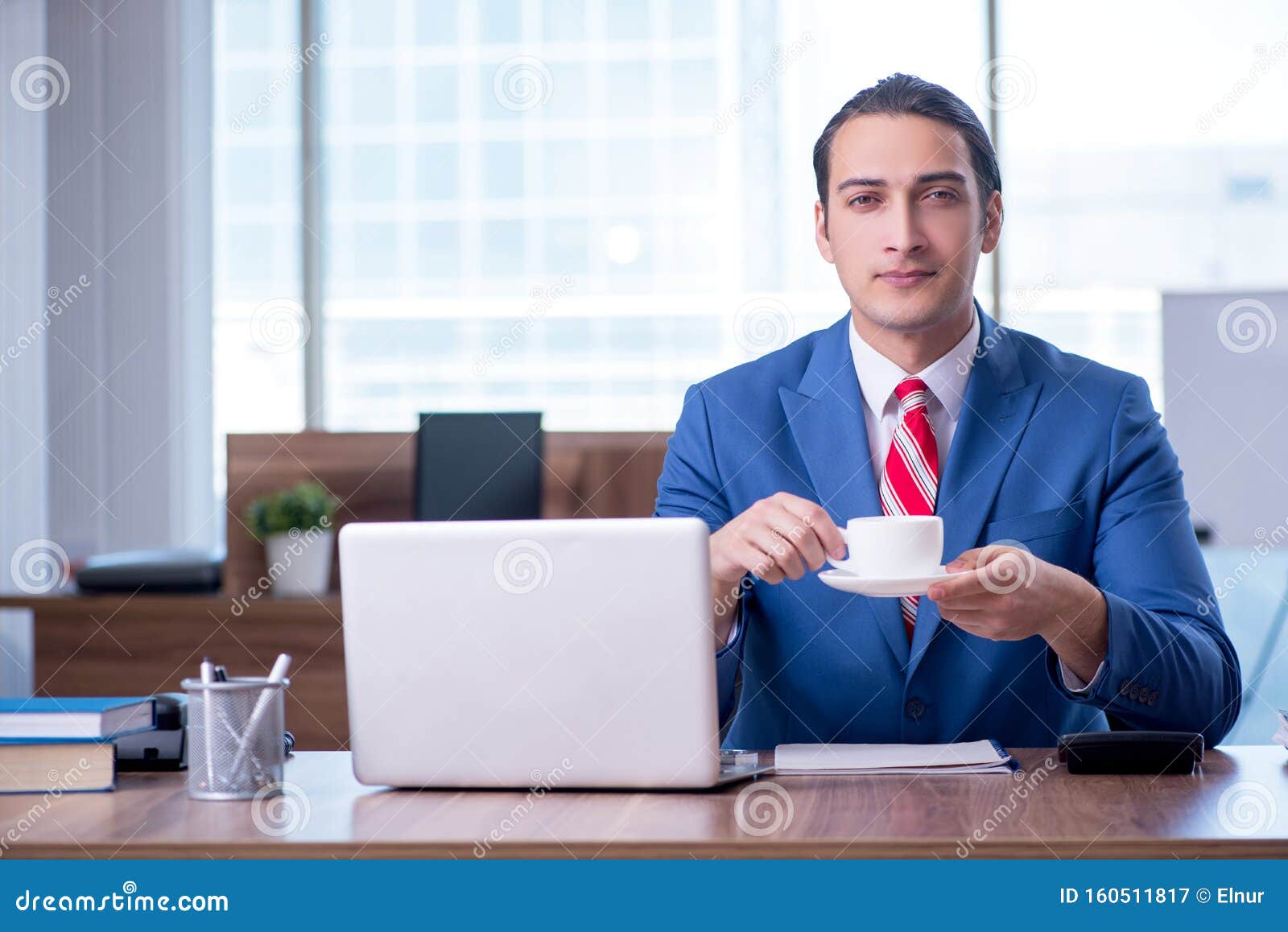 Young Handsome Businessman Sitting in the Office Stock Image - Image of ... Young Handsome Businessman Sitting in the Office Stock Image - Image of ...