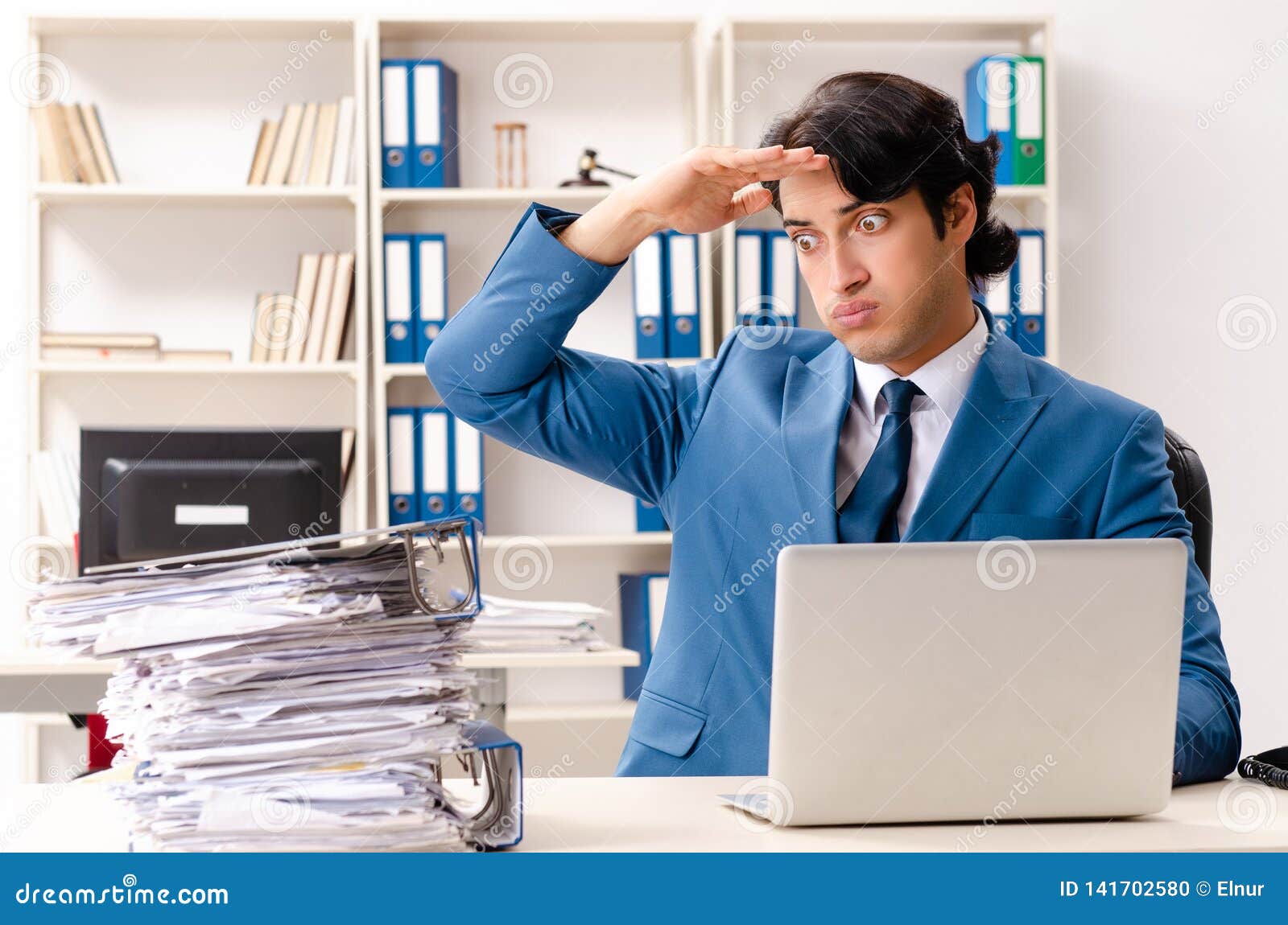 The Young Handsome Busy Employee Sitting in Office Stock Photo - Image ...