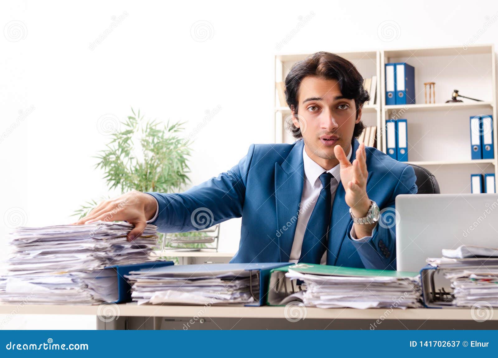 The Young Handsome Busy Employee Sitting in Office Stock Image - Image ...