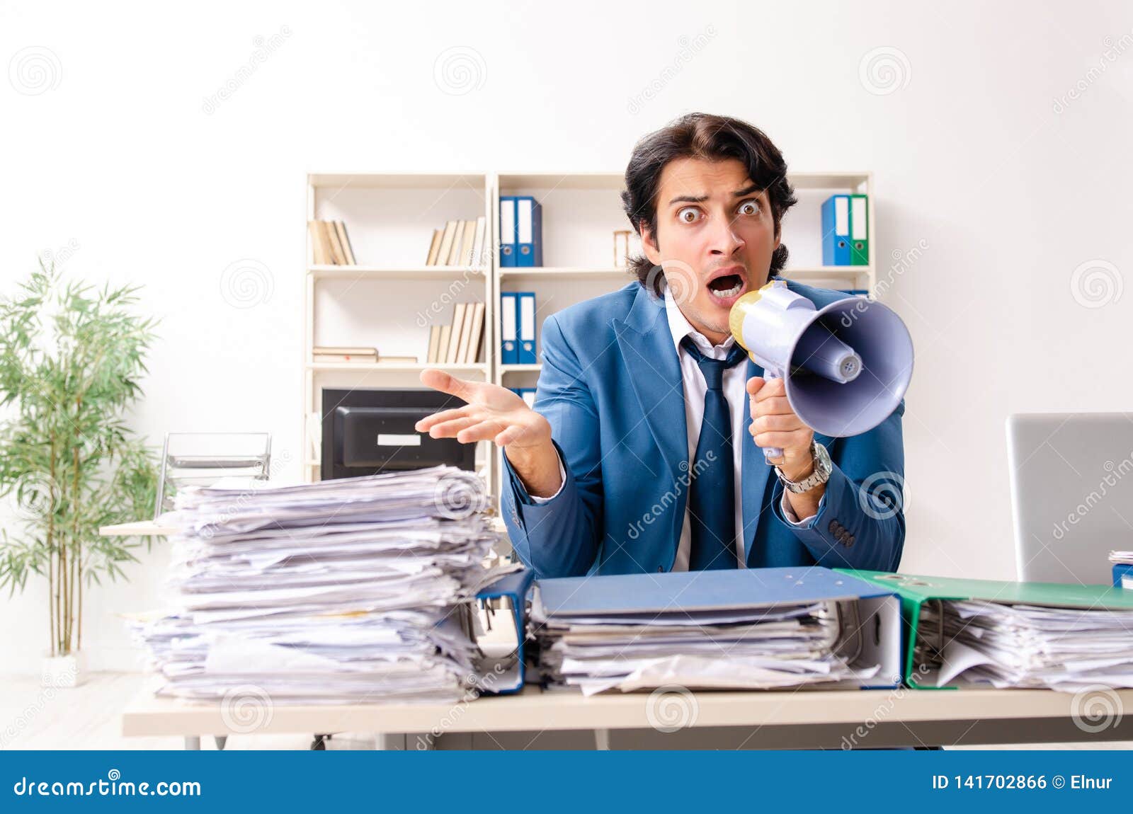 The Young Handsome Busy Employee Sitting in Office Stock Photo - Image ...