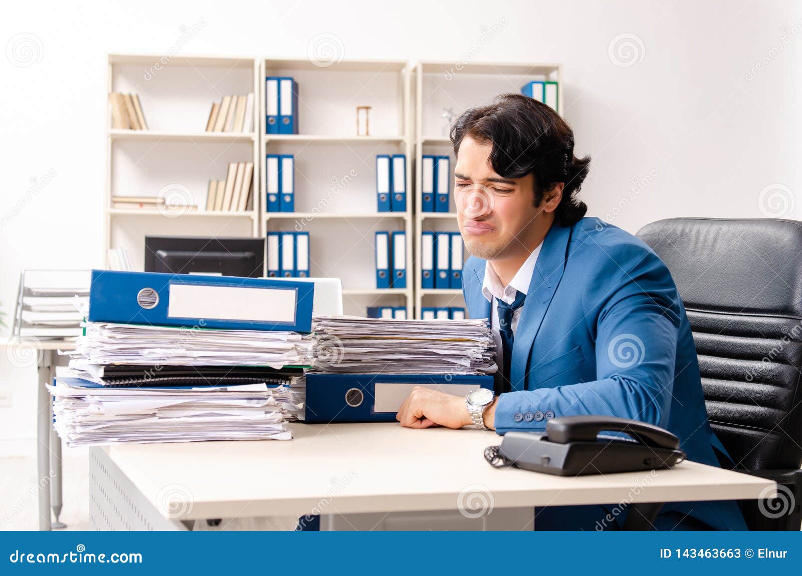 The Young Handsome Busy Employee Sitting in Office Stock Image - Image ...