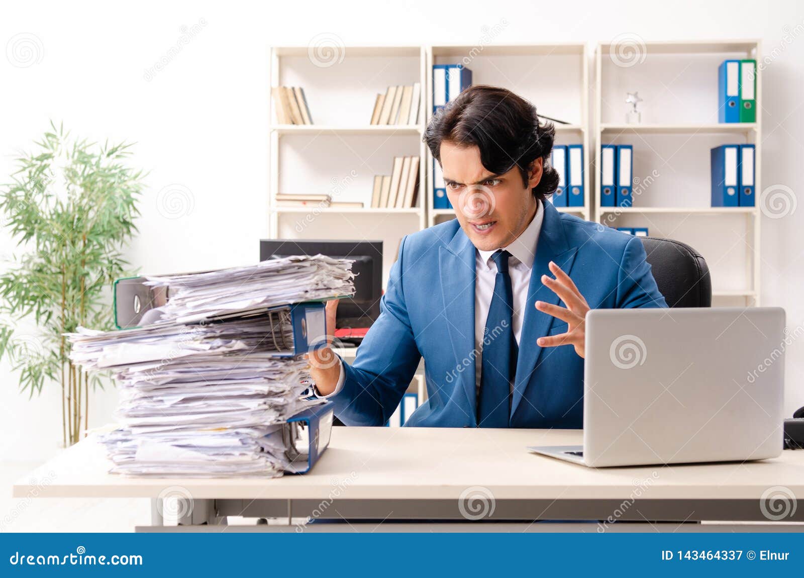 The Young Handsome Busy Employee Sitting in Office Stock Image - Image ...