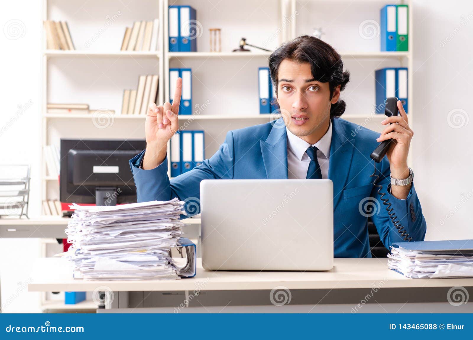 The Young Handsome Busy Employee Sitting in Office Stock Photo - Image ...