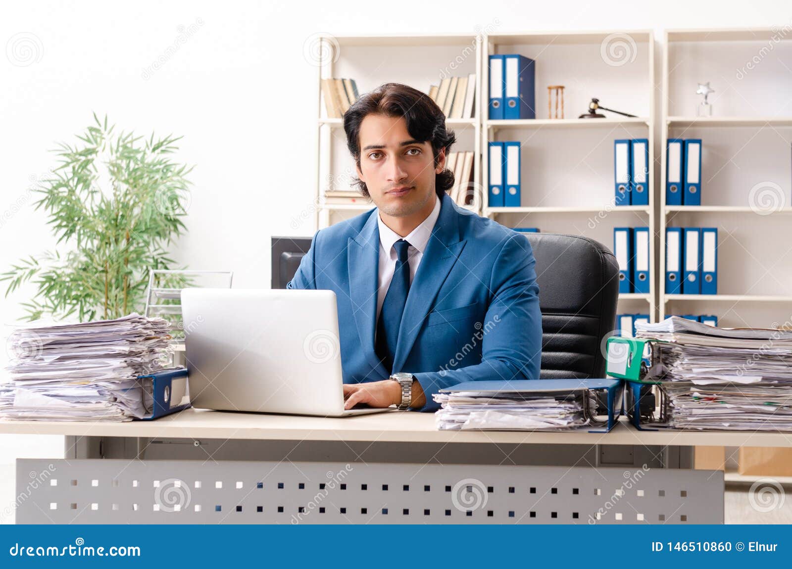 The Young Handsome Busy Employee Sitting in Office Stock Photo - Image ...