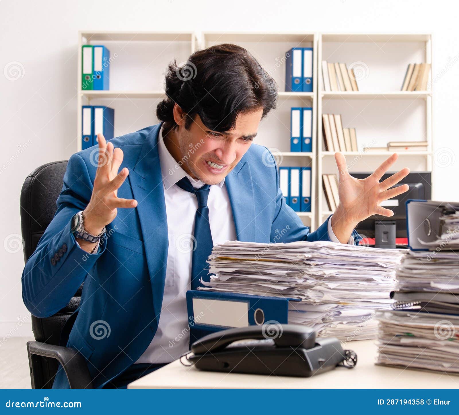Young Handsome Busy Employee Sitting in Office Stock Photo - Image of ...