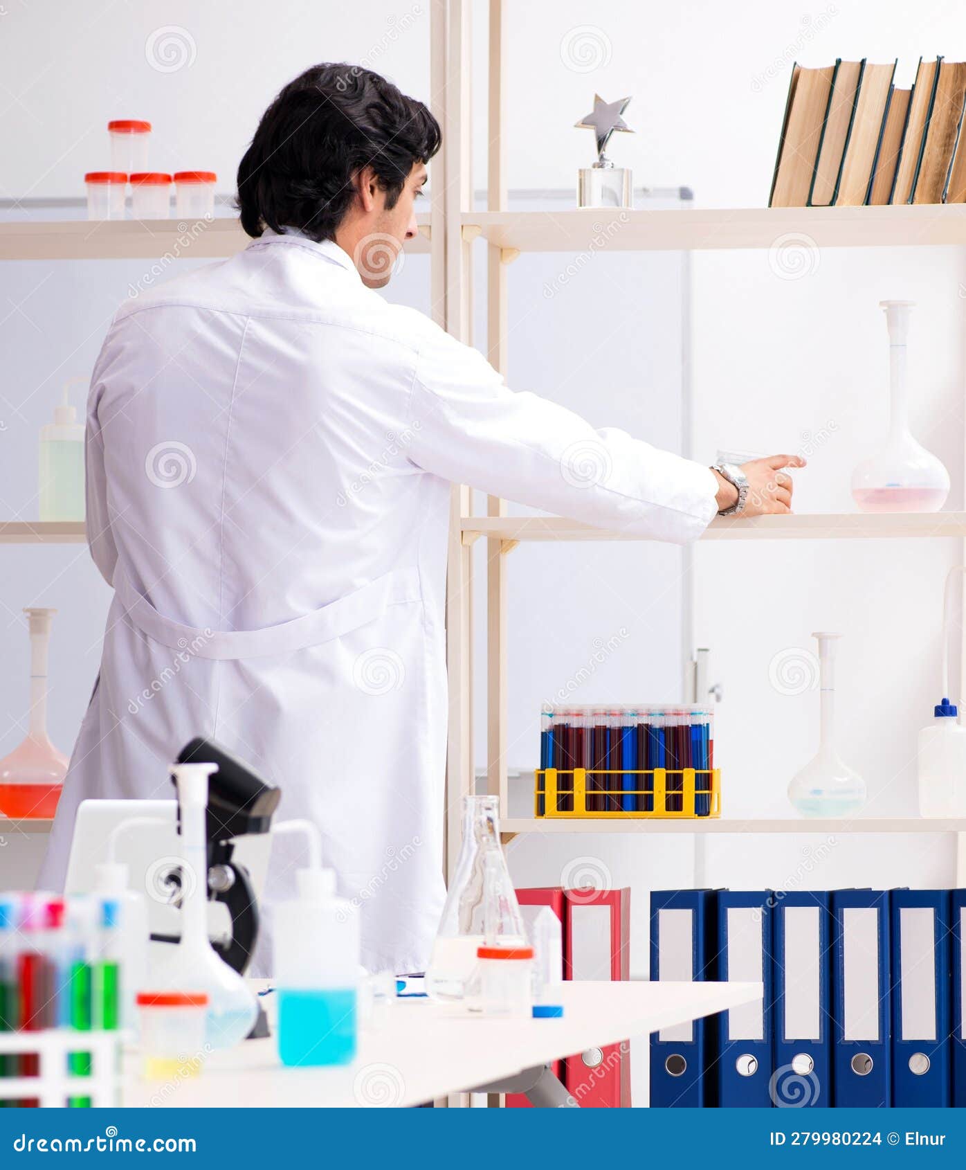Young Handsome Chemist Working in the Lab Stock Photo - Image of ...