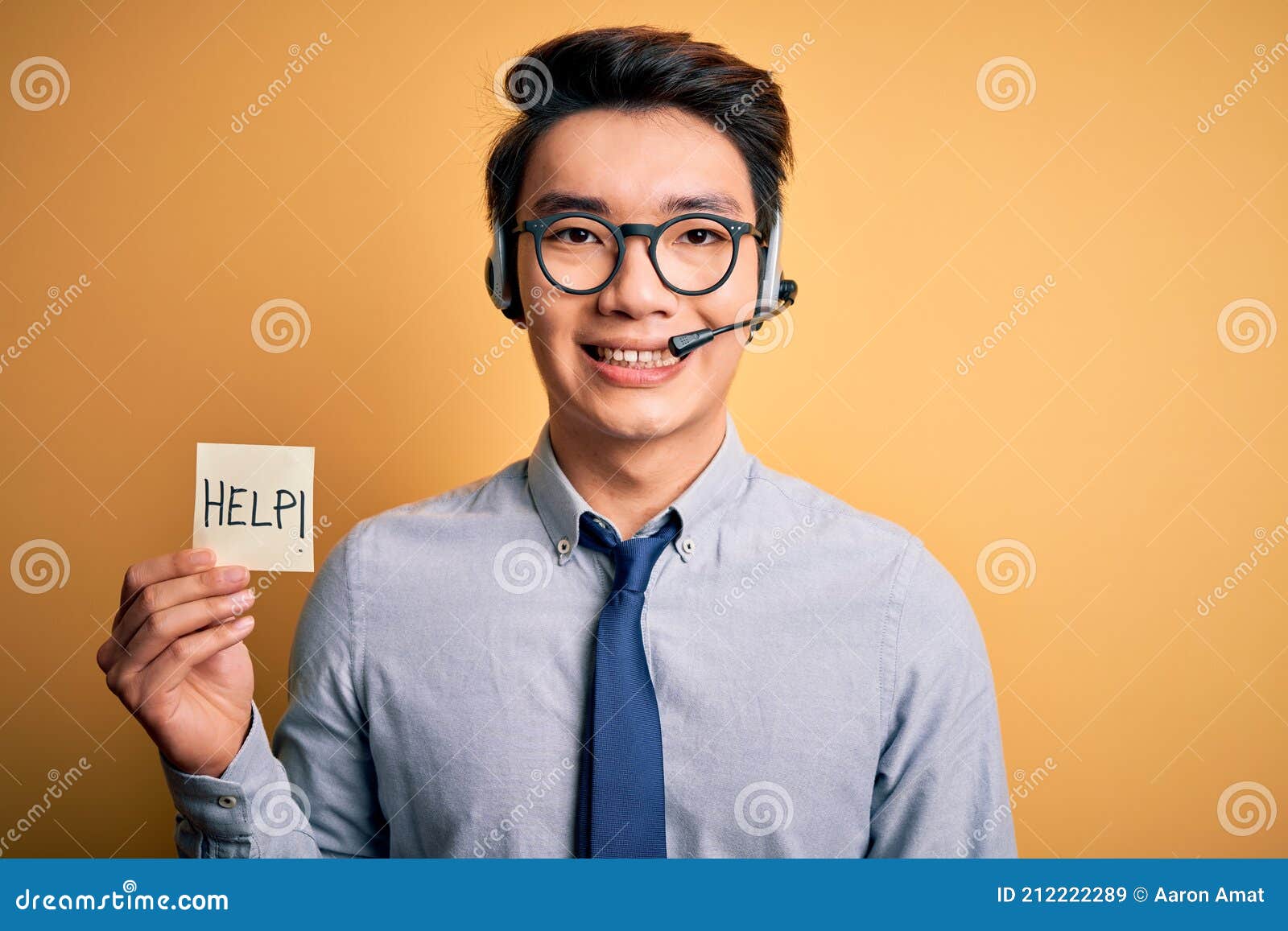 Young Handsome Chinese Call Center Agent Man Overworked Using Headset ...