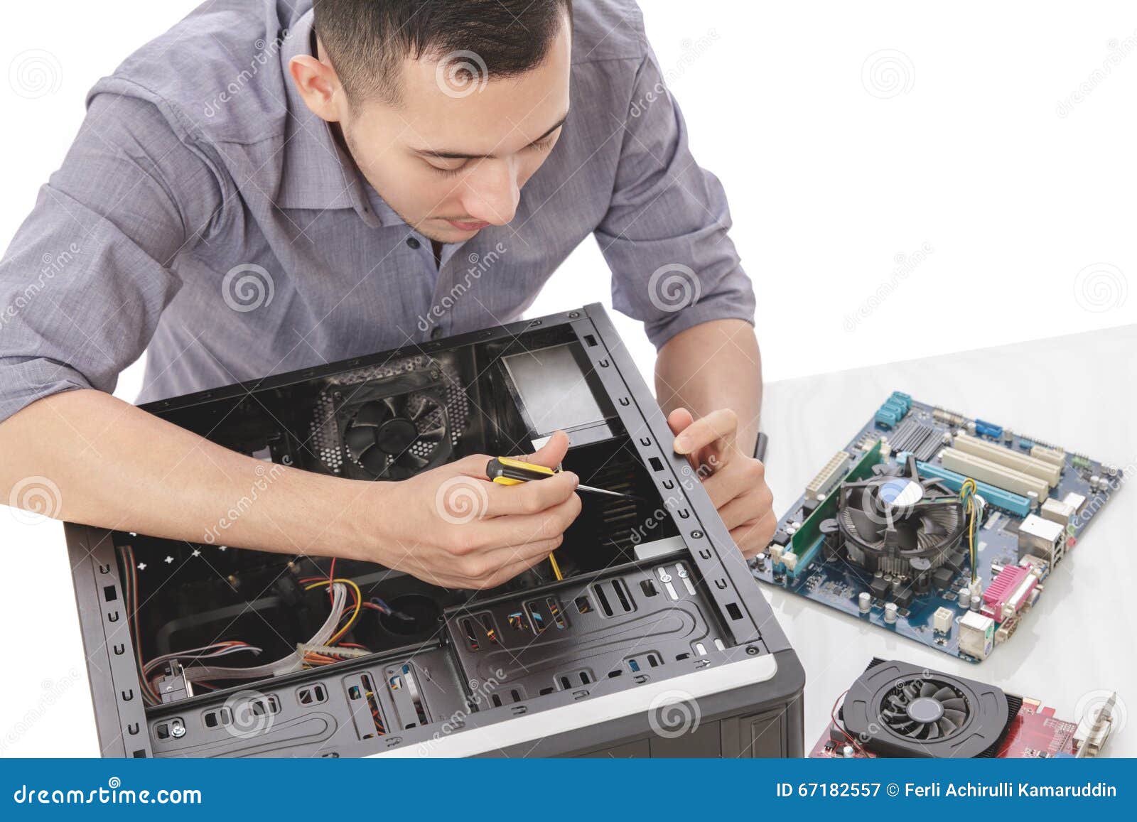Young Handsome Computer Specialist Repairing Computer With Full Stock ...