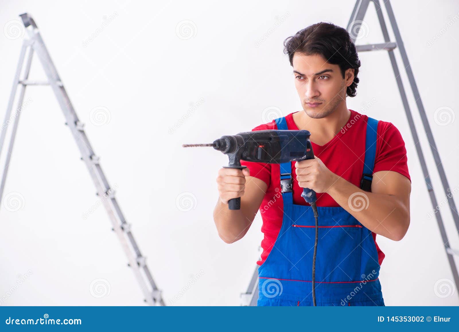 The Young Handsome Contractor Working Indoors Stock Photo - Image of ...