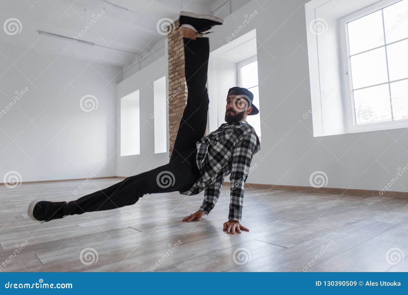 Young Handsome Dancer Man with Cap in Shirt with Sneakers Dances Stock ...