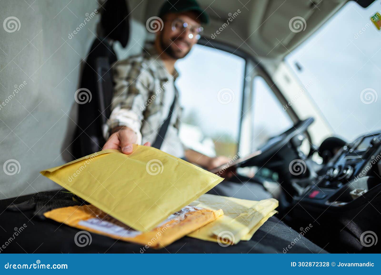 Handsome Delivery Guy Getting His Deliveries Ready Stock Photo - Image ...