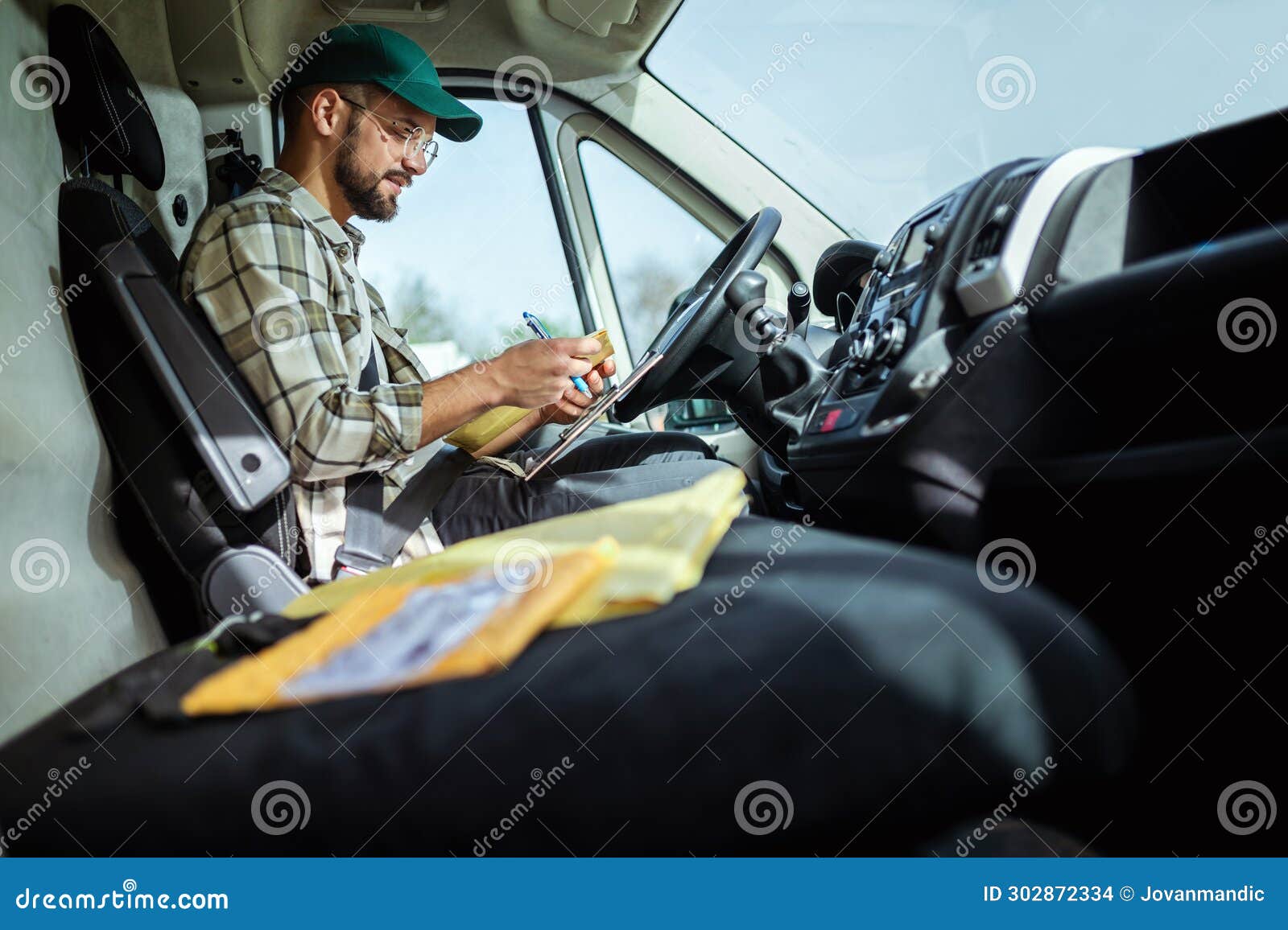 Handsome Delivery Guy Getting His Deliveries Ready Stock Photo - Image ...