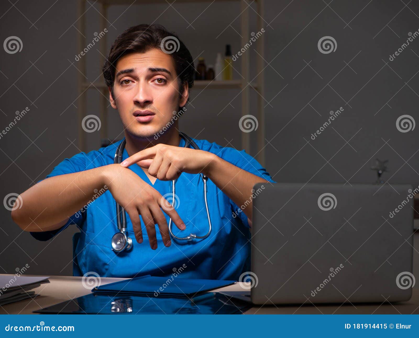 Young Handsome Doctor Working Night Shift in Hospital Stock Image ...