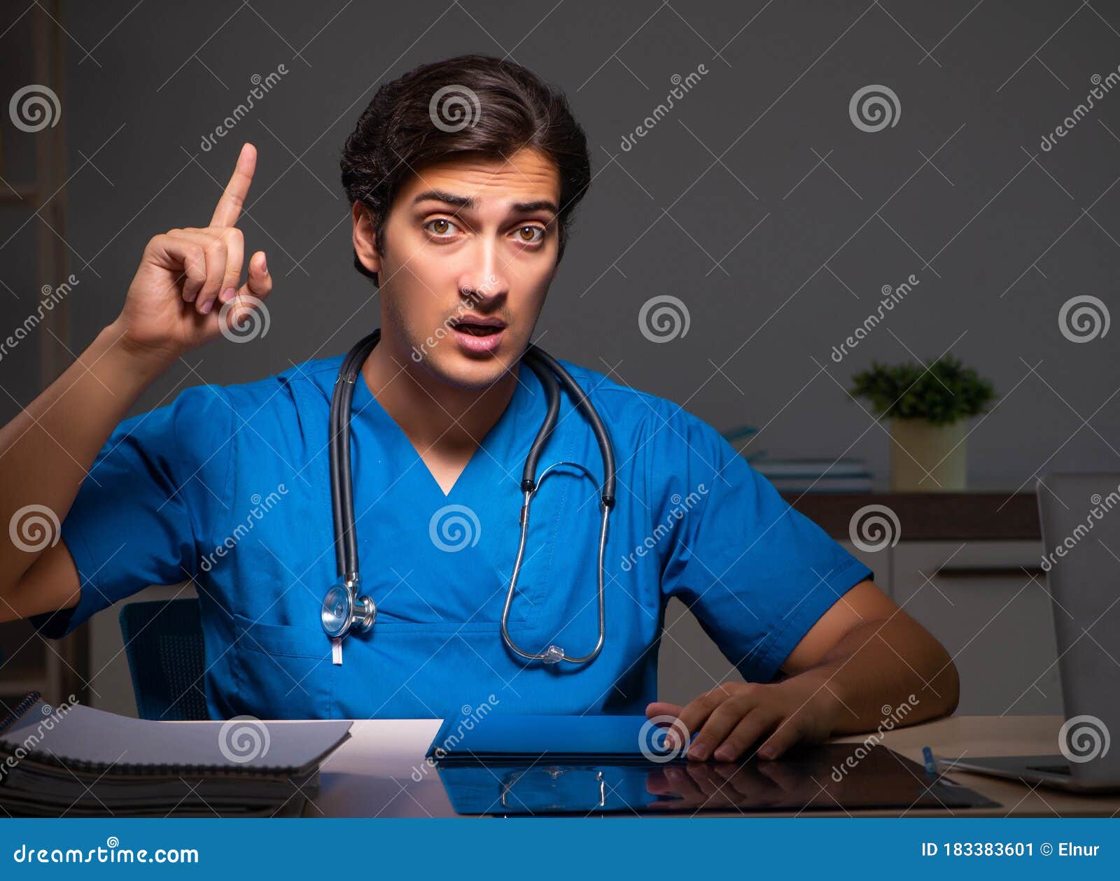 Young Handsome Doctor Working Night Shift in Hospital Stock Image ...