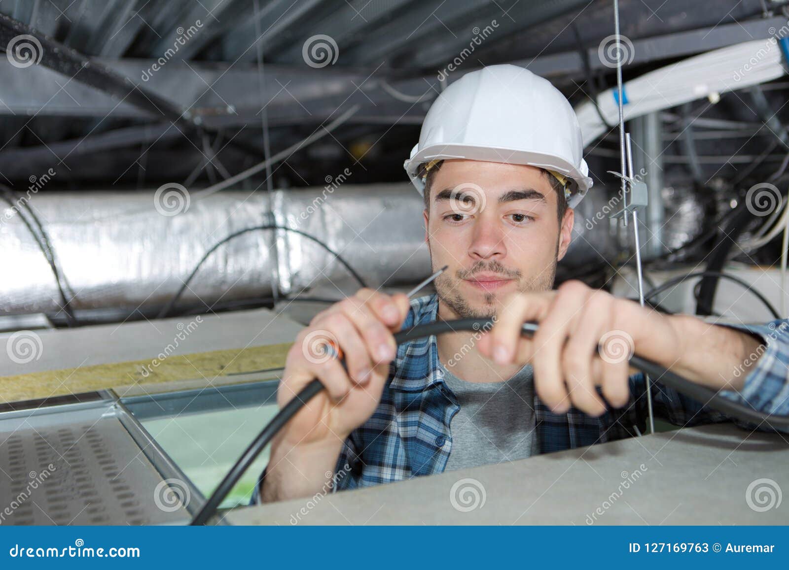 Young Handsome Electrician Wiring Inside Ceiling Stock Image - Image of ...