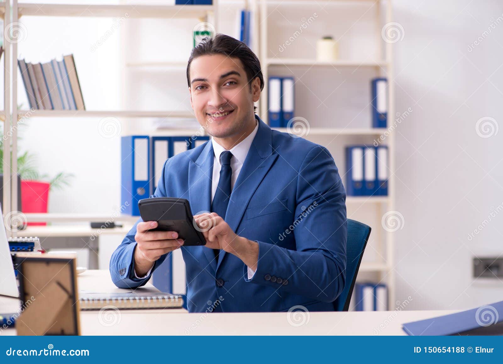 Young Handsome Employee in the Office Stock Photo - Image of bookkeeper ...
