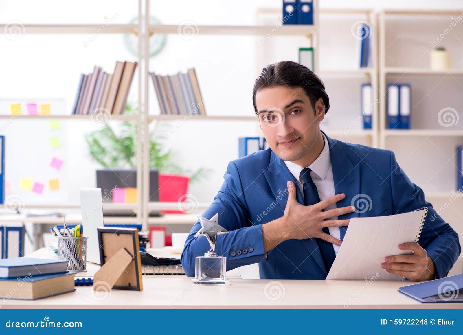 Young Handsome Employee in the Office Stock Photo - Image of month ...