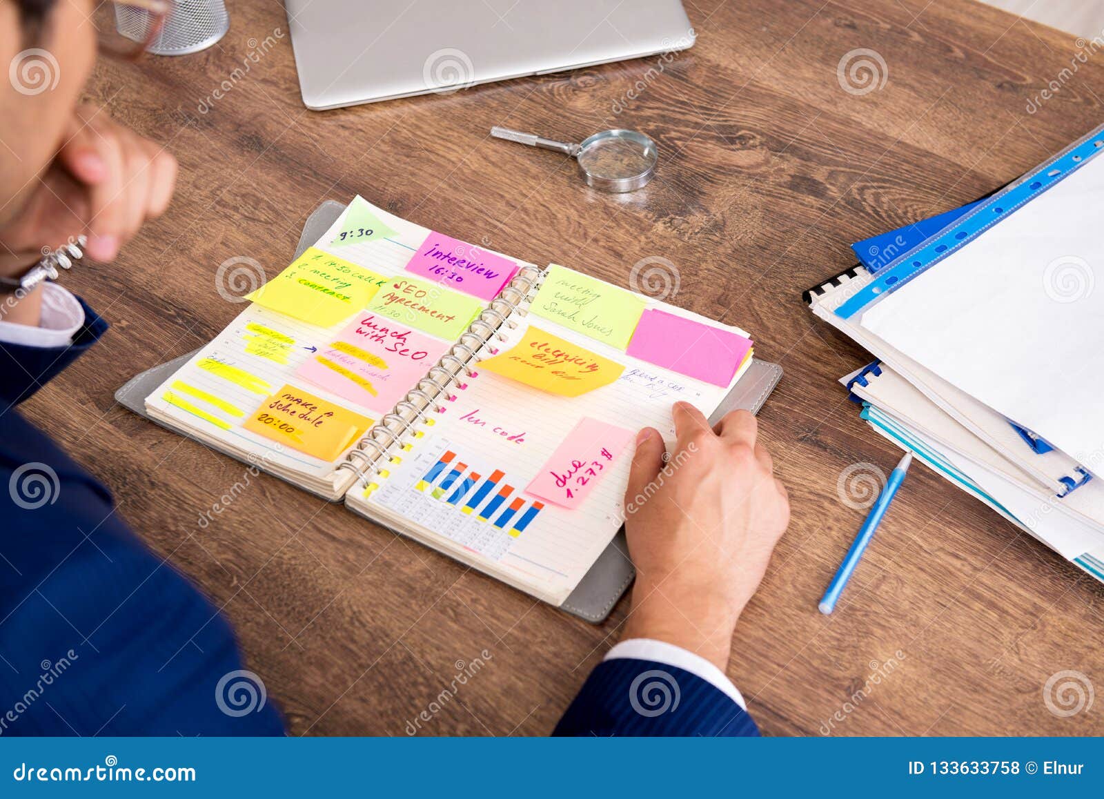 The Young Handsome Employee Planning His Work Activity Stock Photo ...