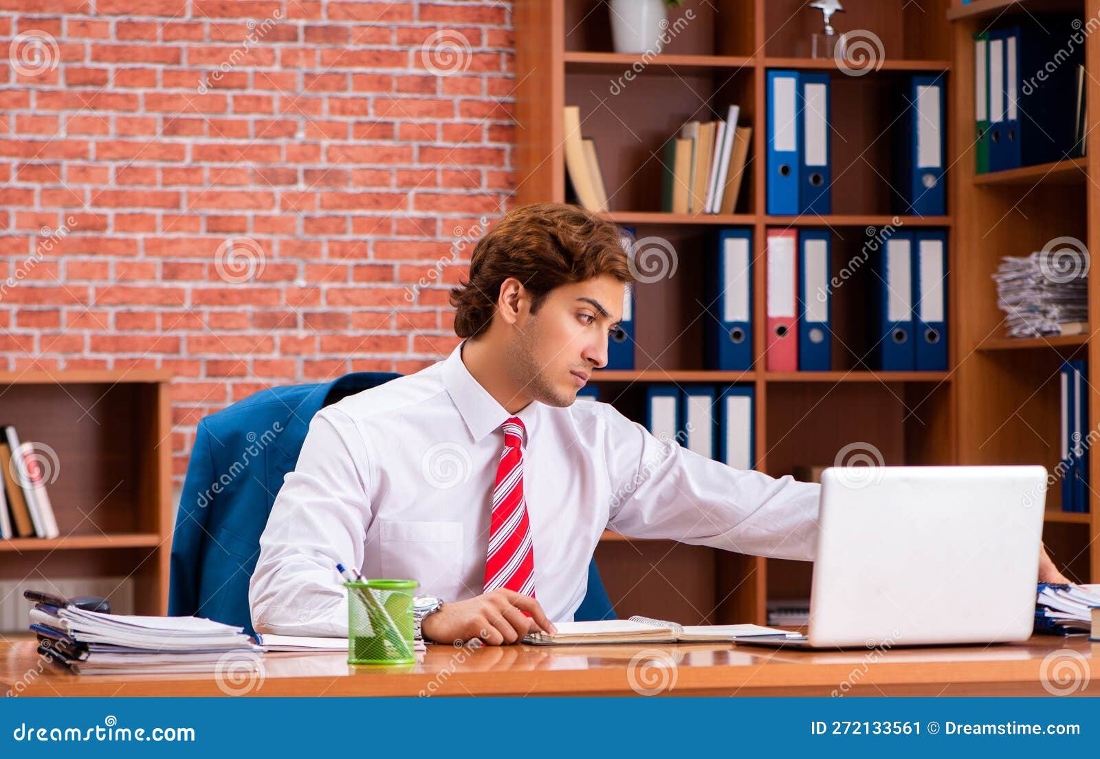 Young Handsome Employee Sitting in the Office Stock Image - Image of ...
