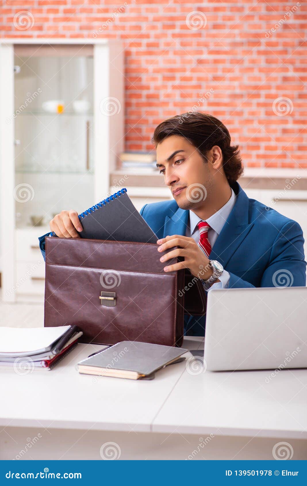 The Young Handsome Employee Working in the Office Stock Photo - Image ...