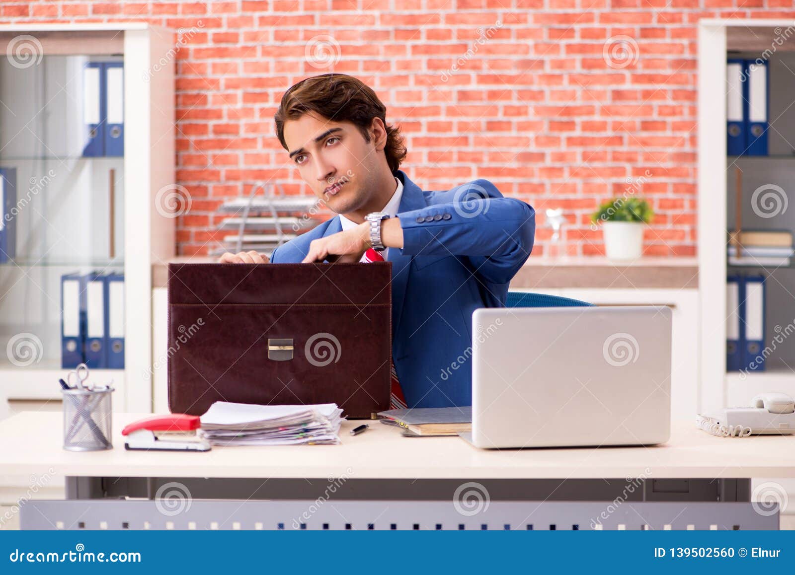 The Young Handsome Employee Working in the Office Stock Photo - Image ...