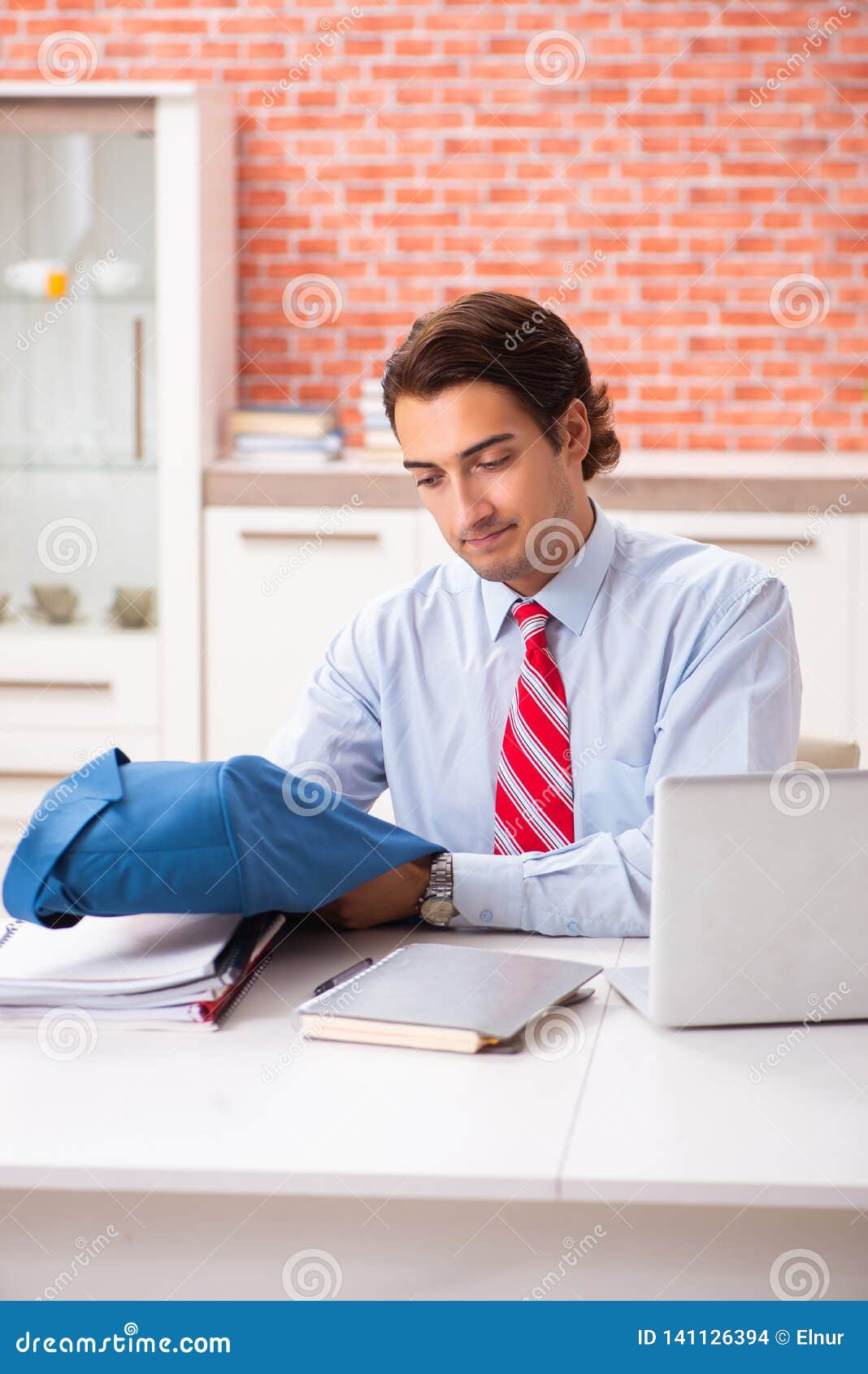The Young Handsome Employee Working in the Office Stock Photo - Image ...