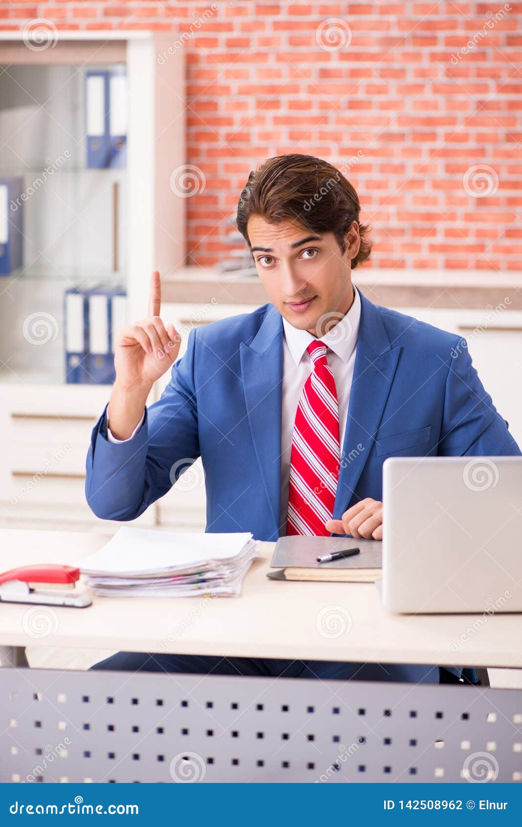 The Young Handsome Employee Working in the Office Stock Photo - Image ...